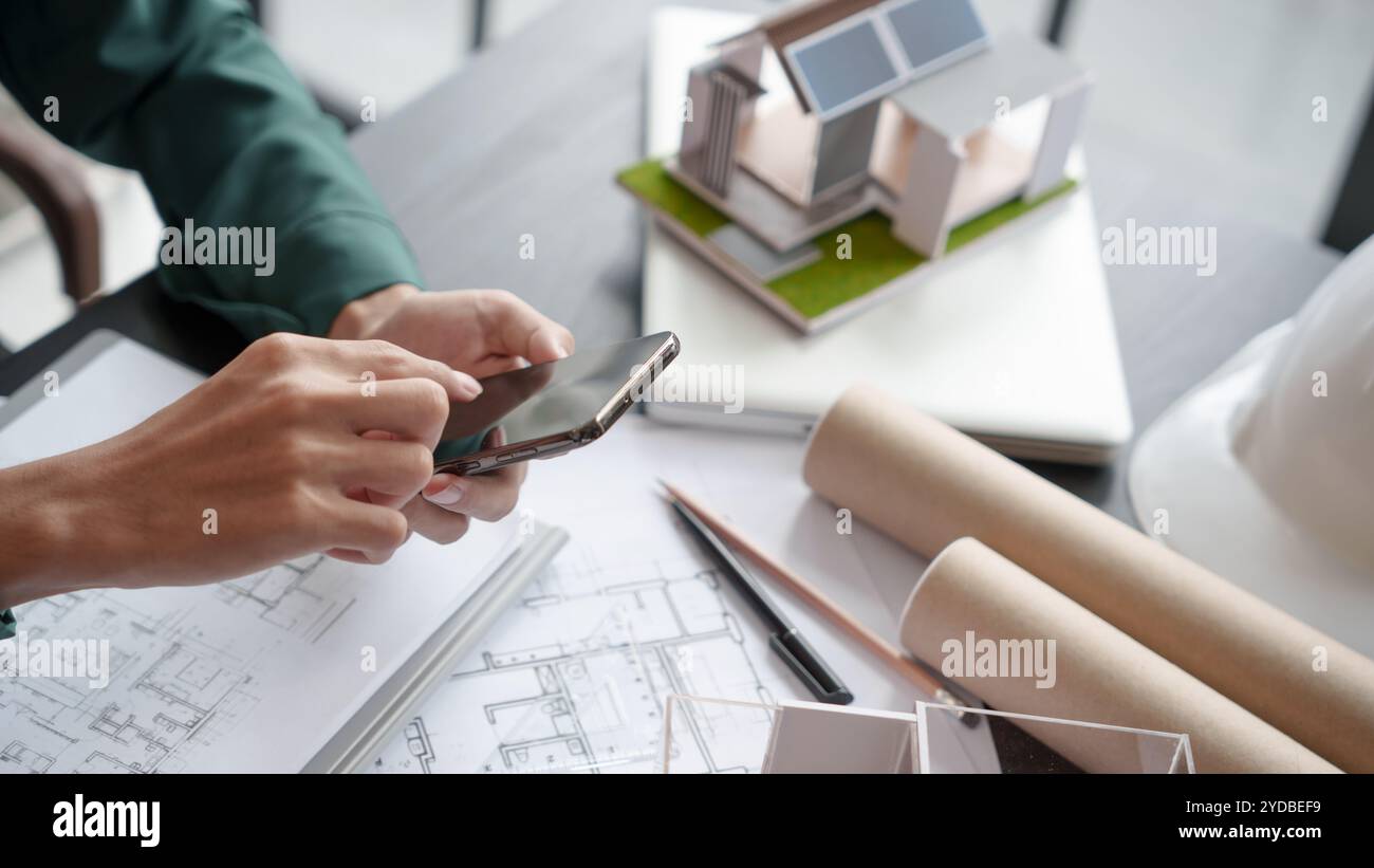 Architecture Man use smart phone for architectural Creative project ...