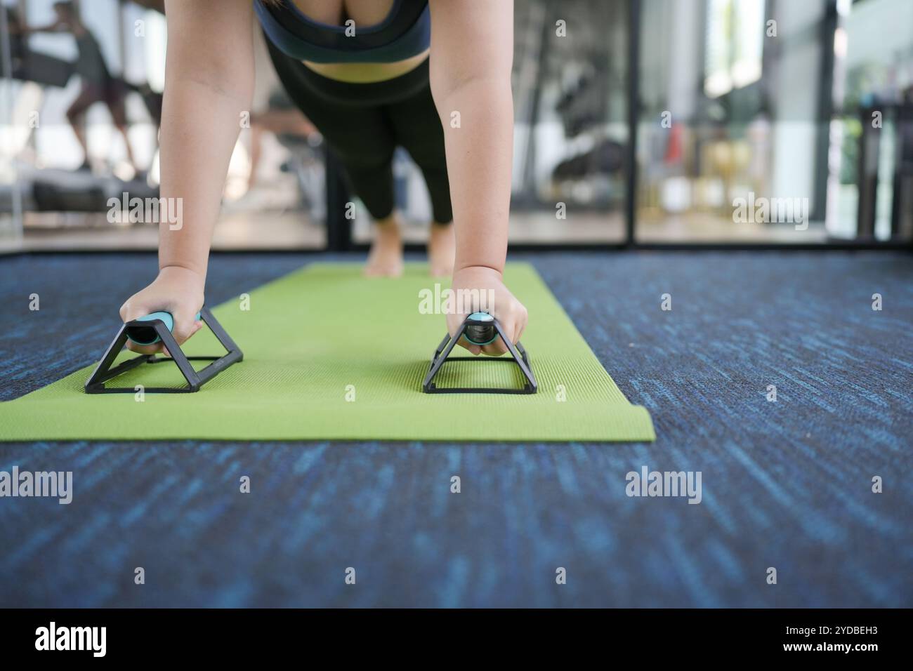 Overweight woman exercising for weight loss. plank exercise in ...