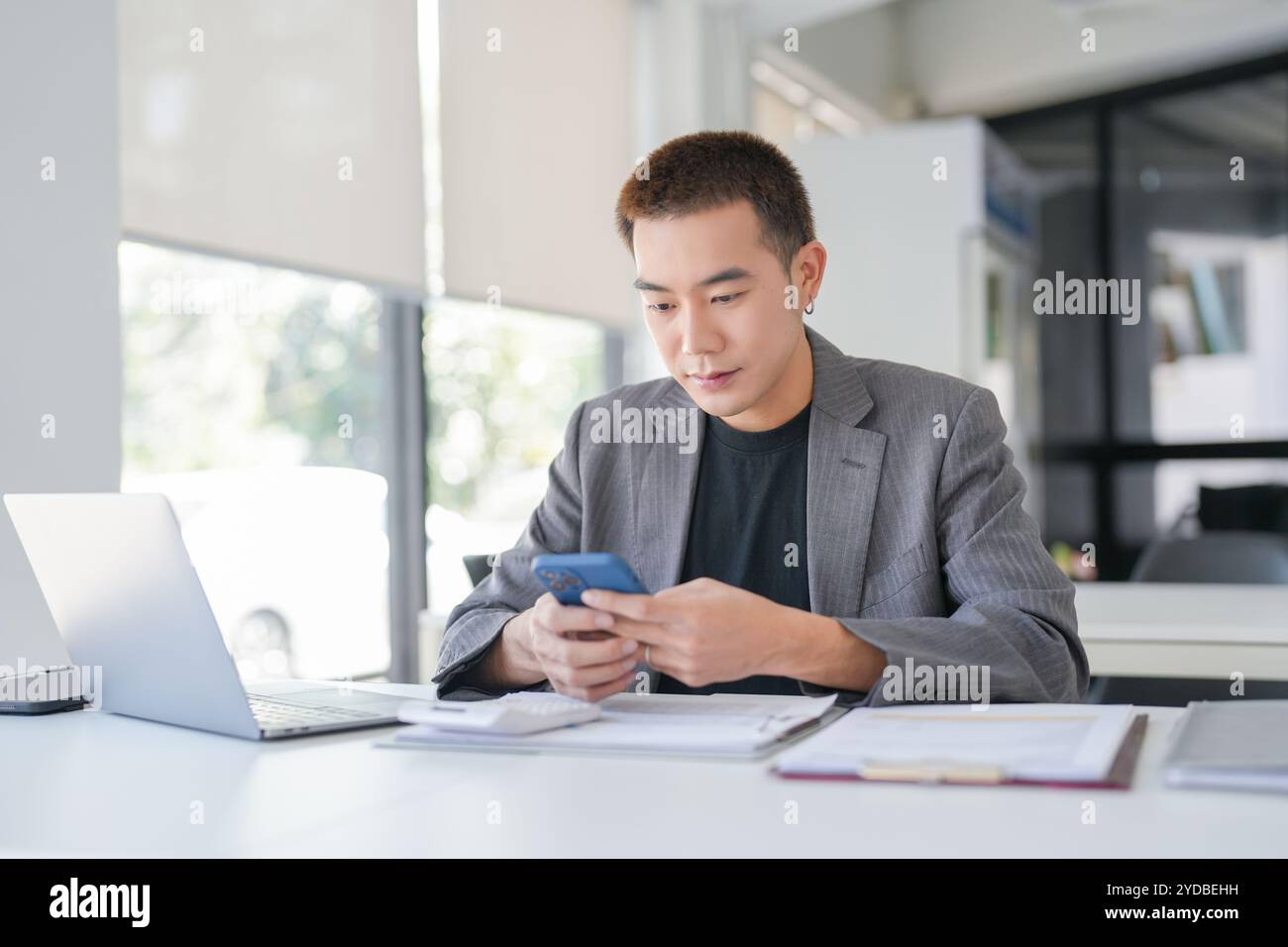 Asian Business man working with laptop. Young business man thinking ...