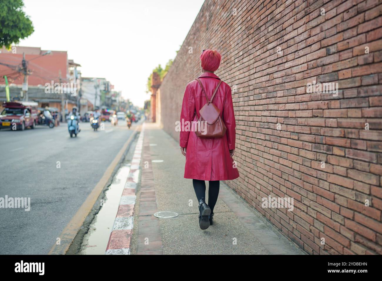 Gen z girl leather fashion with punk Asian woman tourist of local city ...