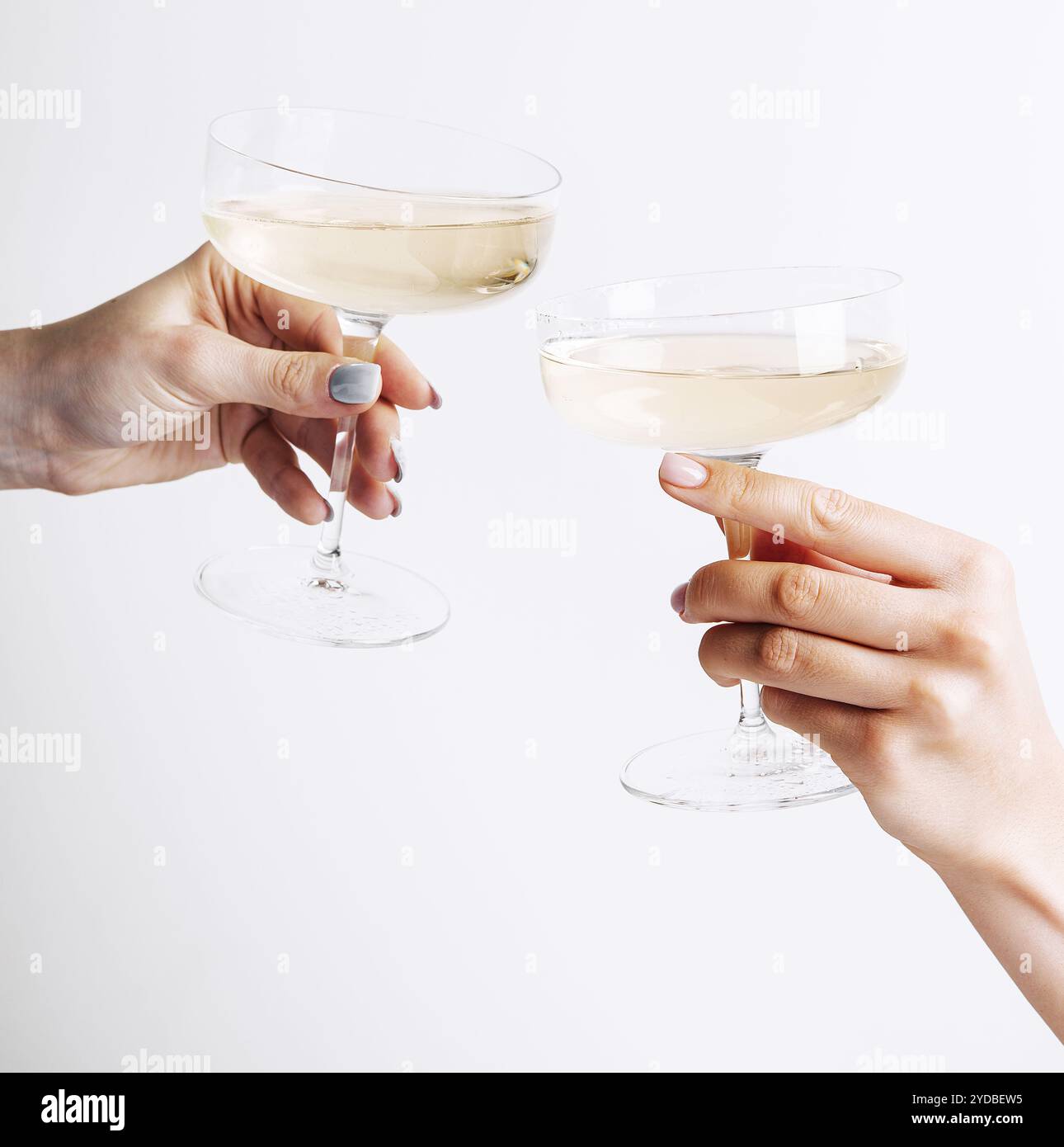 Cheers. Prosecco or white wine in beautiful glasses Stock Photo - Alamy