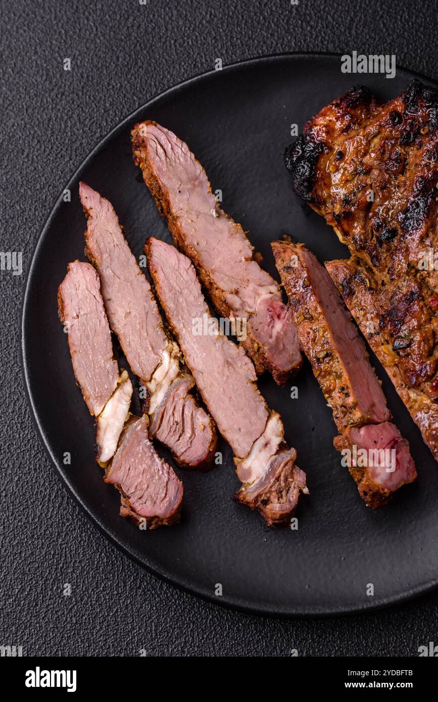 Juicy beef tomahawk steak on the bone baked on the grill Stock Photo ...