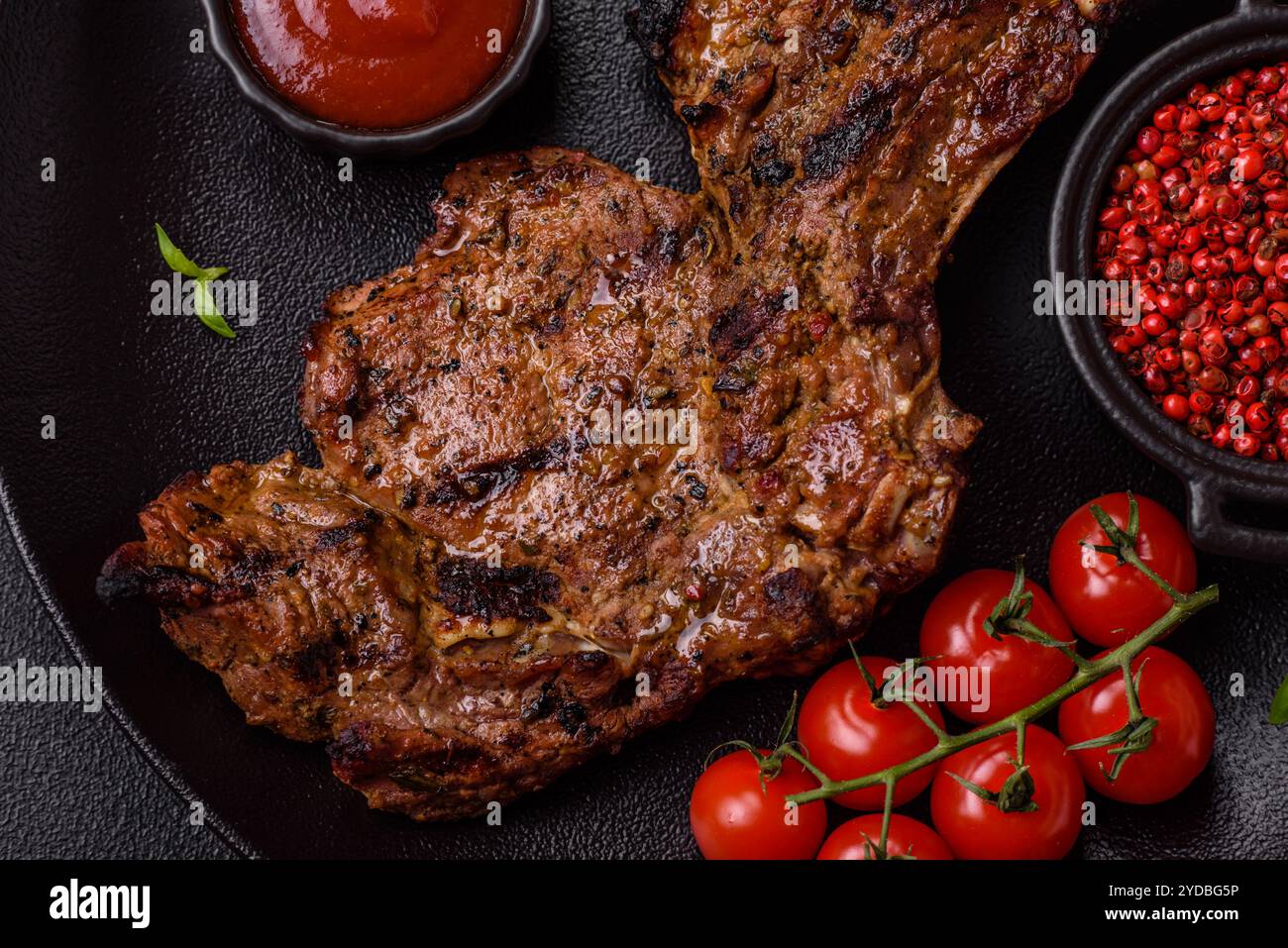 Juicy beef tomahawk steak on the bone baked on the grill Stock Photo ...