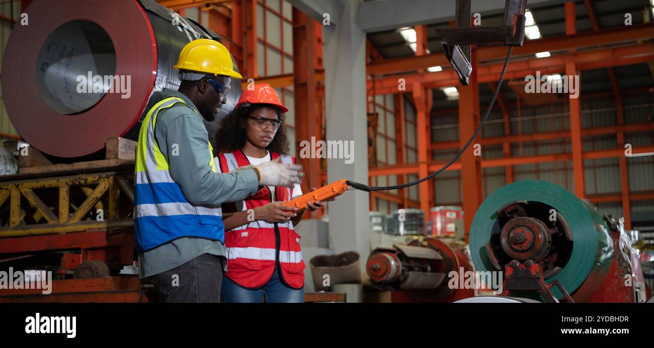 Two technicians Inspecting and testing the operation of lifting cranes ...