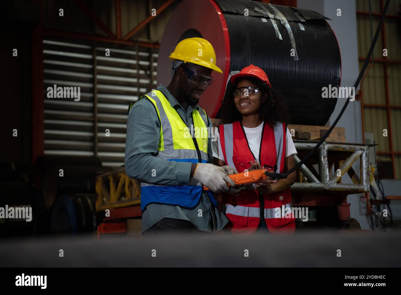 Two technicians Inspecting and testing the operation of lifting cranes ...
