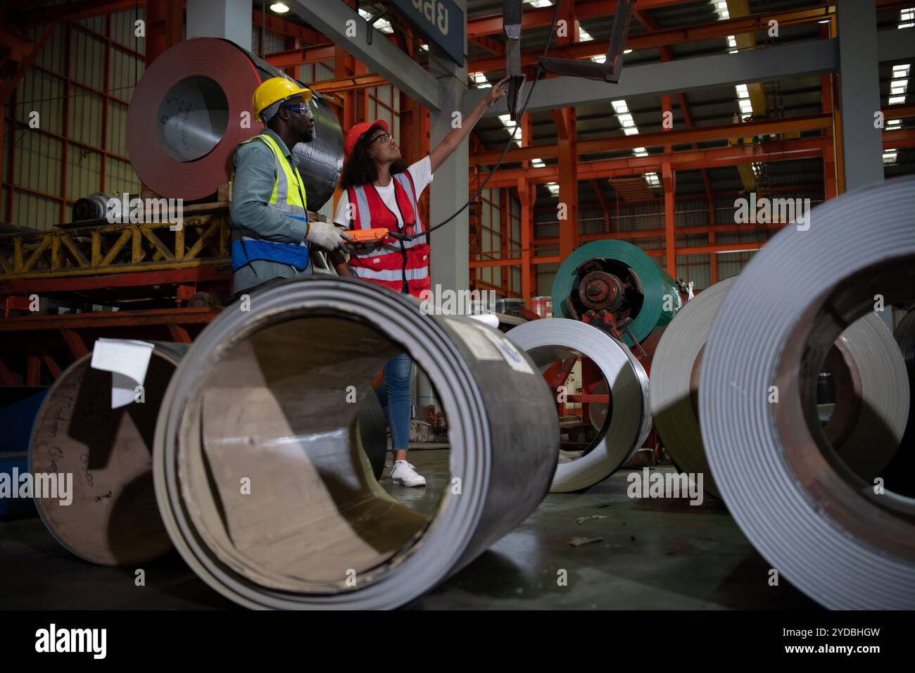 Two technicians Inspecting and testing the operation of lifting cranes ...