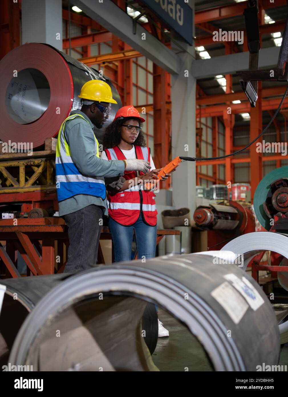 Two technicians Inspecting and testing the operation of lifting cranes ...