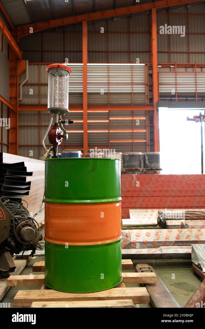 Hand rotate the glass tube with oil on green tank Stock Photo - Alamy