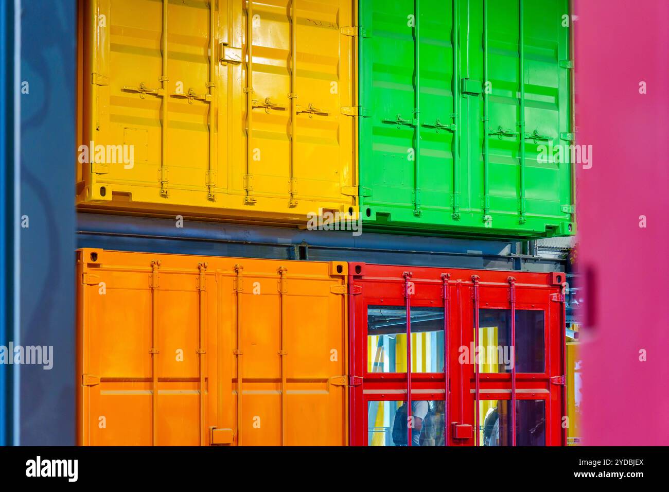 View of warehouse building with various colorful shipping containers ...
