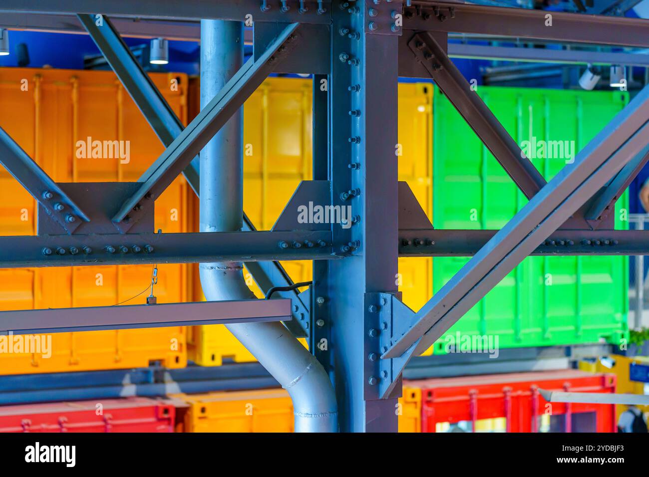 View of warehouse building with various colorful rafters (roof beams ...