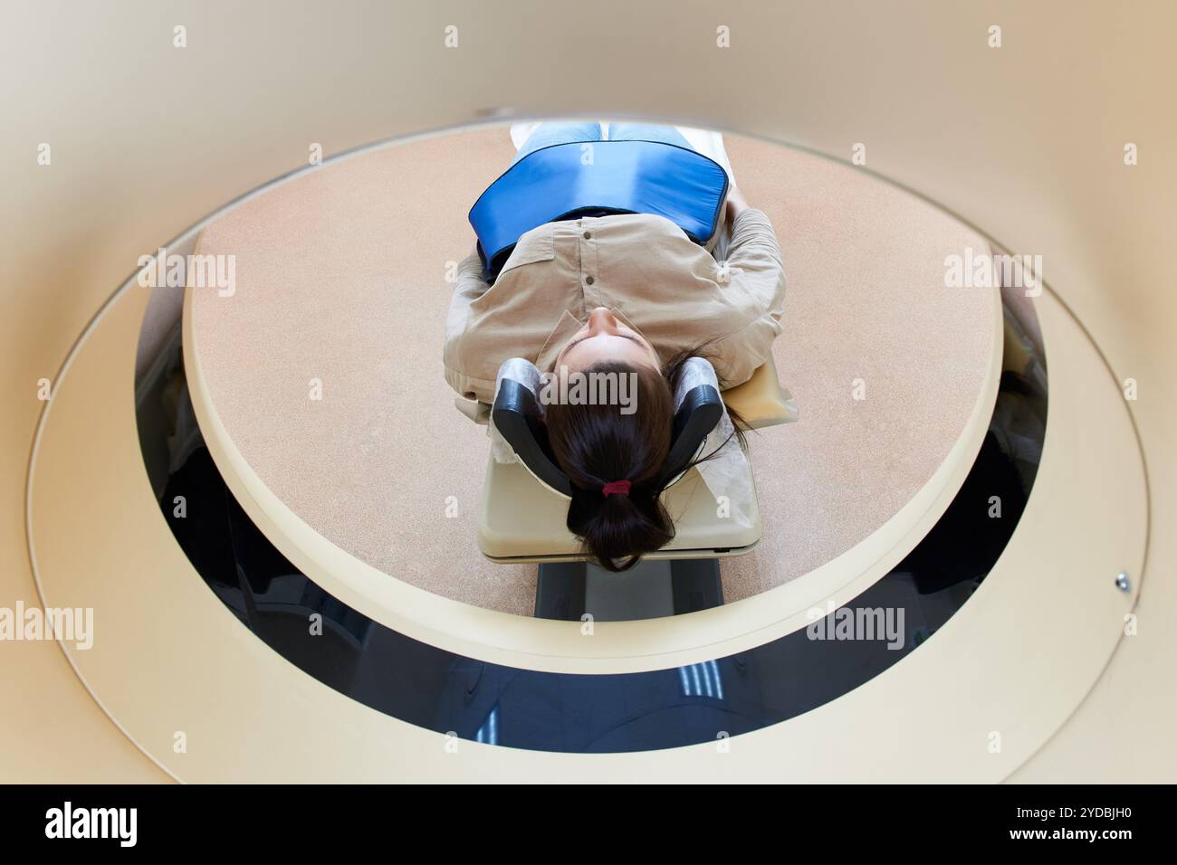 Female patient undergoing MRI - Magnetic resonance imaging in Hospital ...
