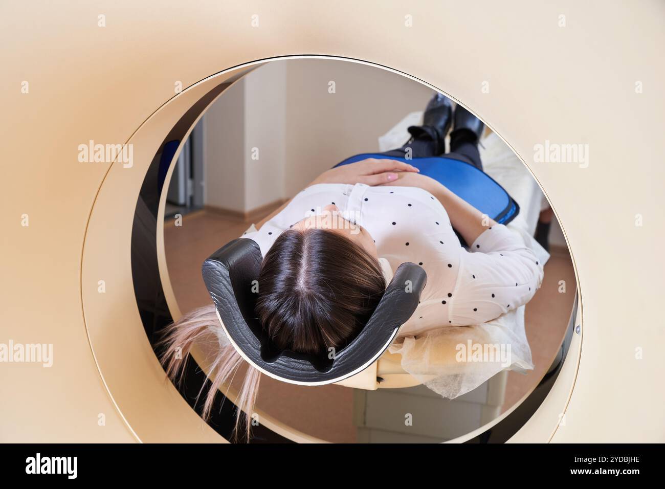 Female patient undergoing MRI - Magnetic resonance imaging in Hospital ...