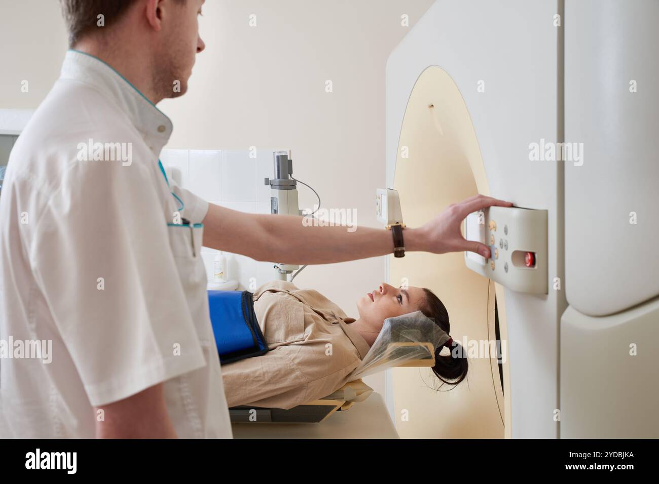 Female patient undergoing MRI - Magnetic resonance imaging in Hospital ...