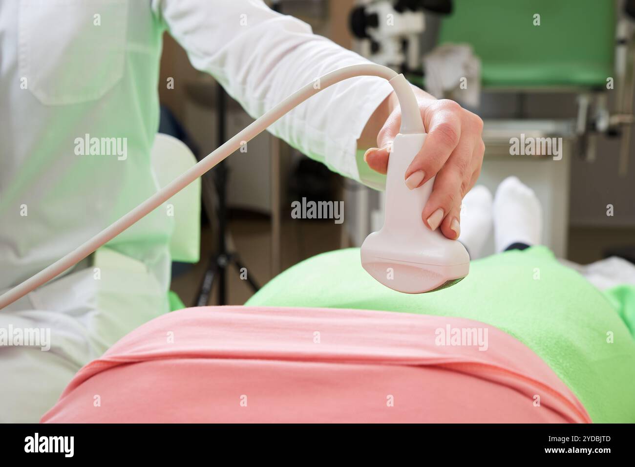 Female gynecologist doctor operating an ultrasound scanner Stock Photo ...