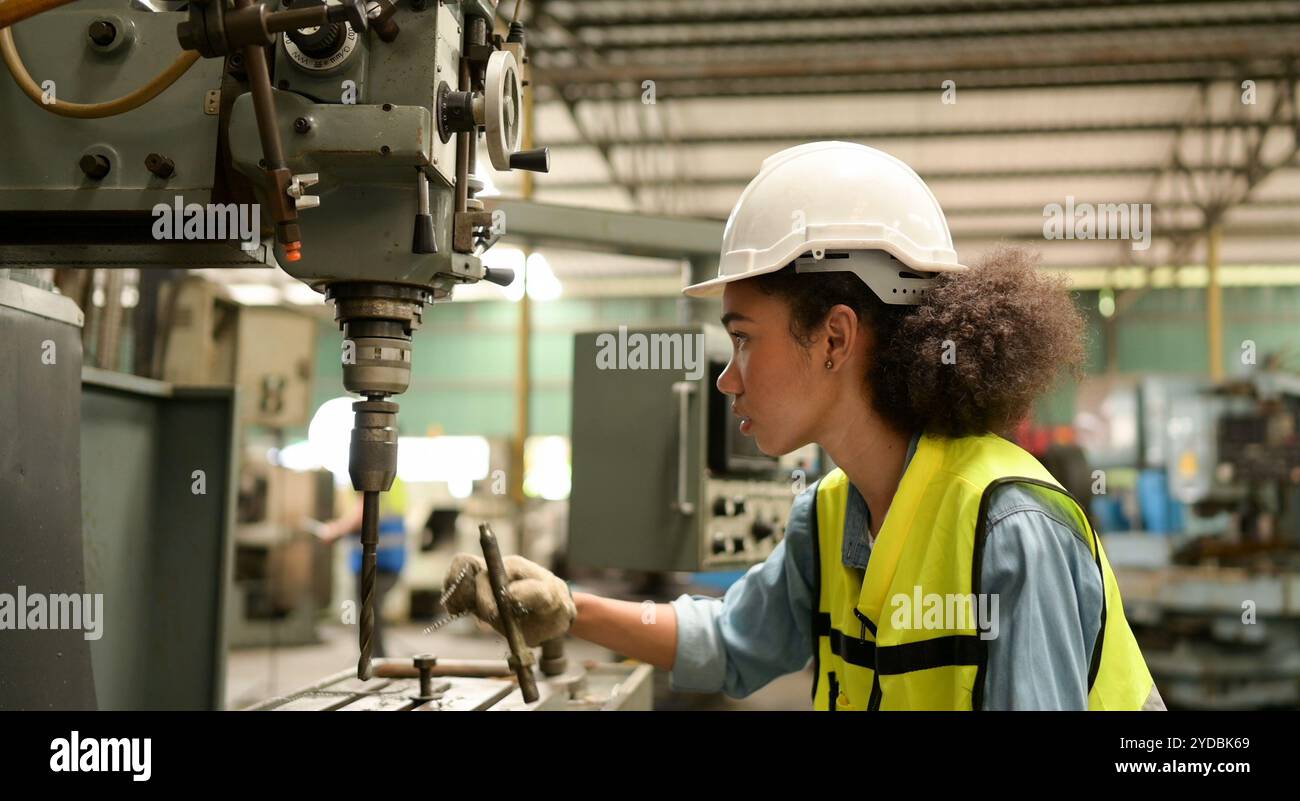 Female chief mechanical engineer work in a mechanical factory to follow ...