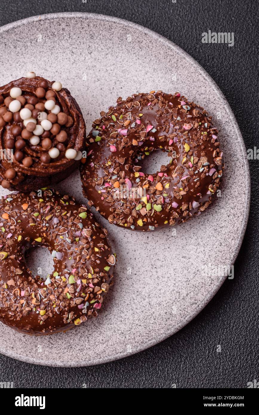 Delicious fresh donuts with filling and chocolate coating Stock Photo ...