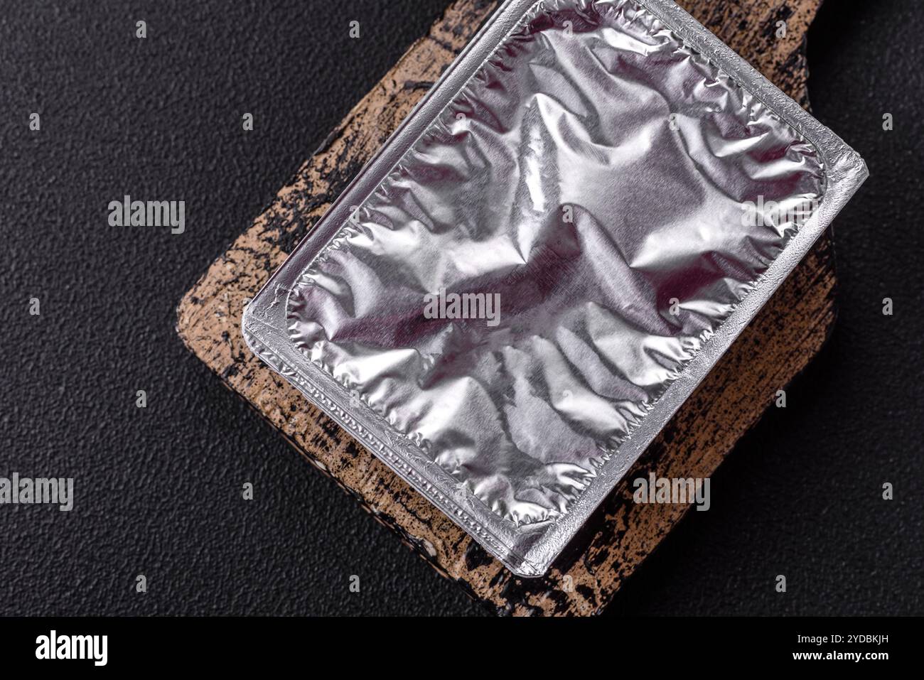 Rectangular plastic box with yogurt or cheese hermetically sealed with ...