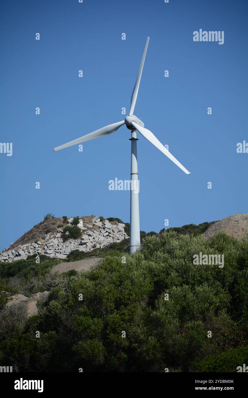 Wind turbines against the blue Sardinian sky, harnessing Mediterranean ...