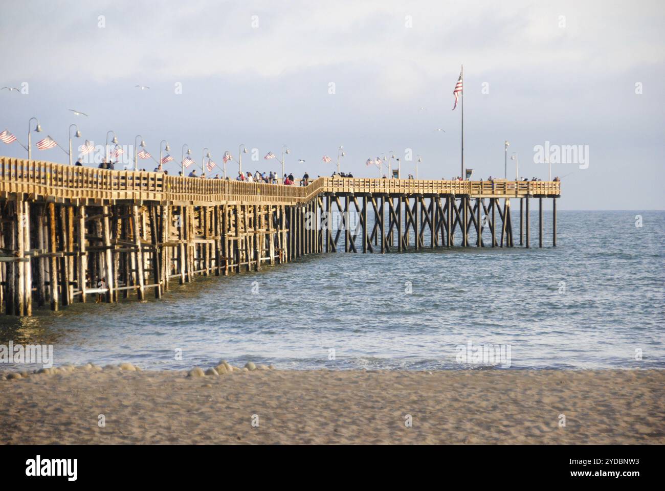 People enjoying beautiful sunset at Ventura Pier in Ventura, California ...