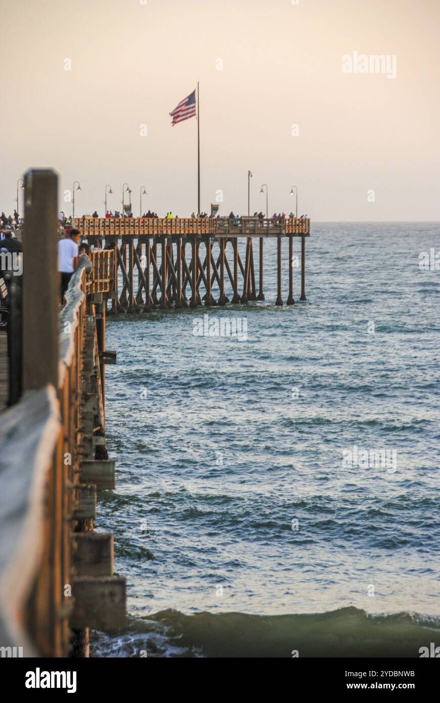 People enjoying a beautiful sunset at Ventura Pier, Ventura, California ...
