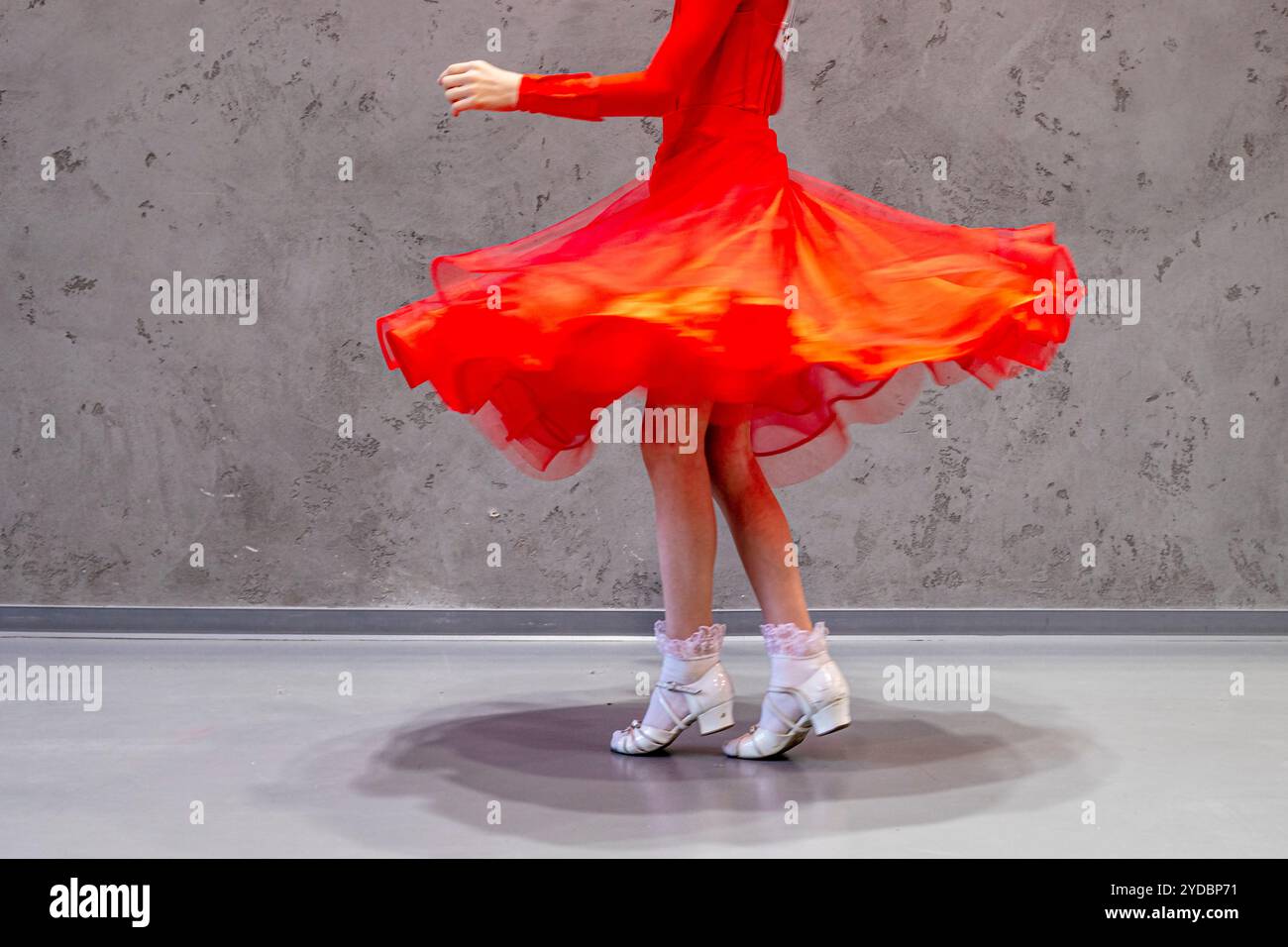 happy girl spinning in bright red dance dress and dance shoes Stock ...