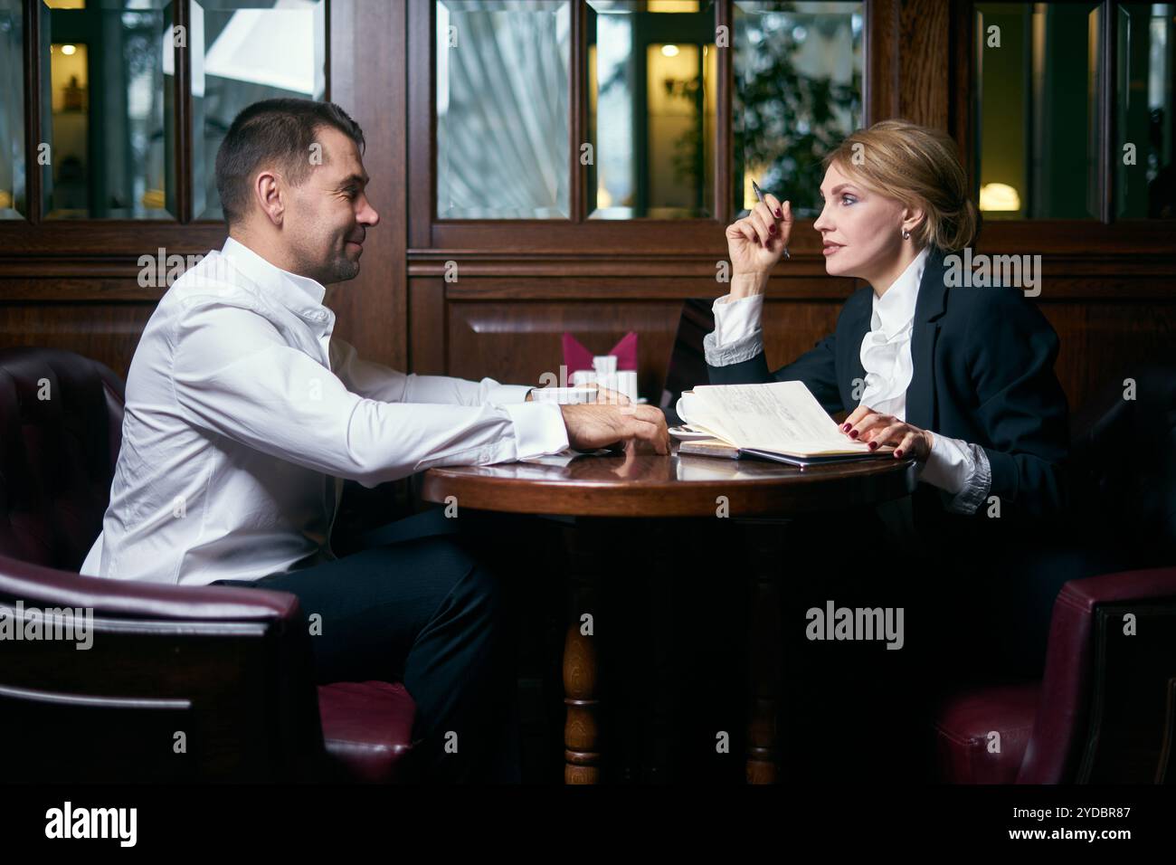 Two male business colleagues talking hi-res stock photography and ...