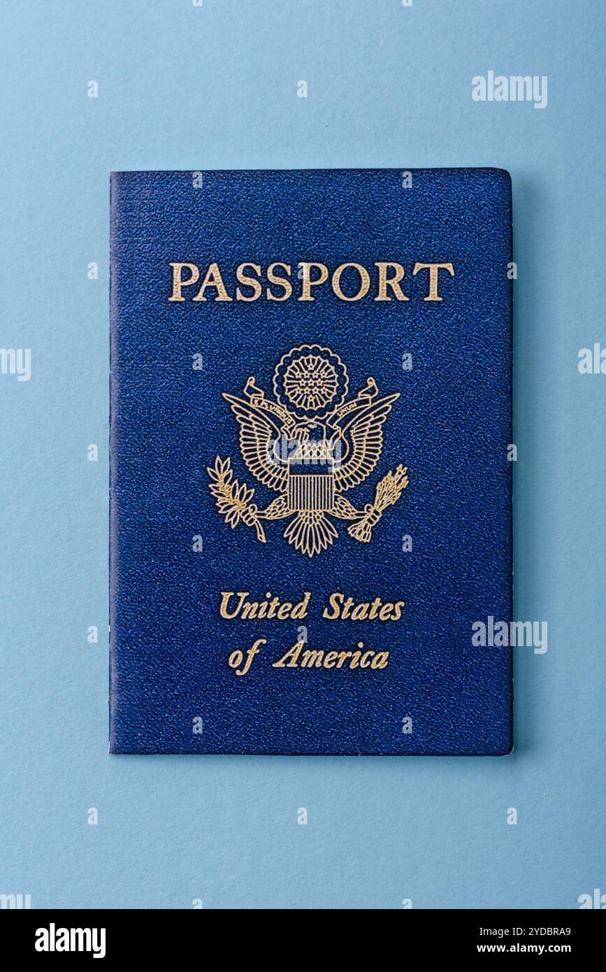 United states of america passport on a blue background Stock Photo - Alamy