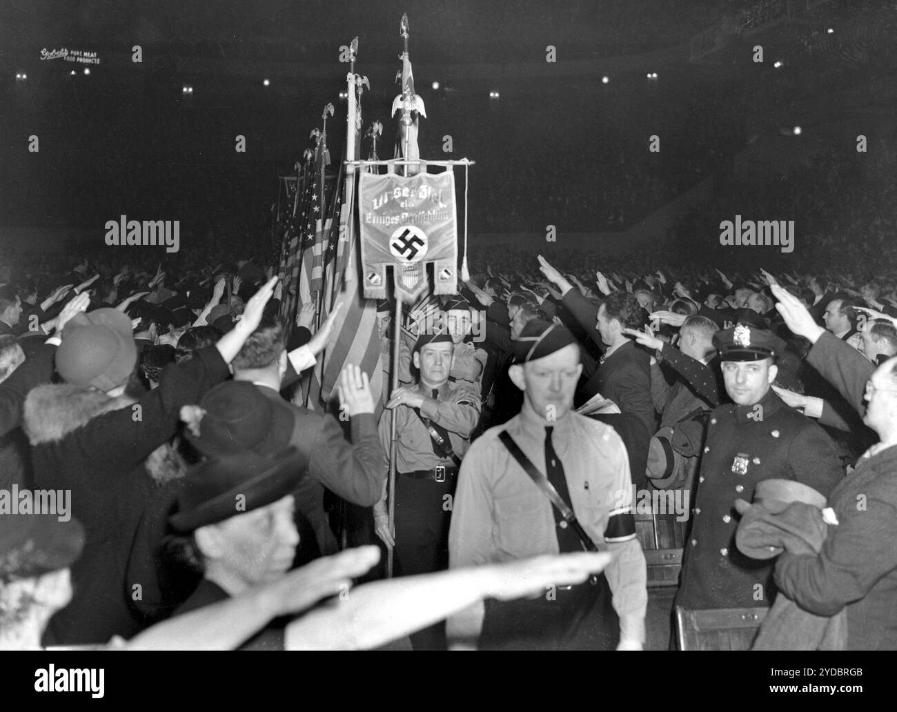 FILE - The crowd responds with a Hitler salute as uniformed members of ...