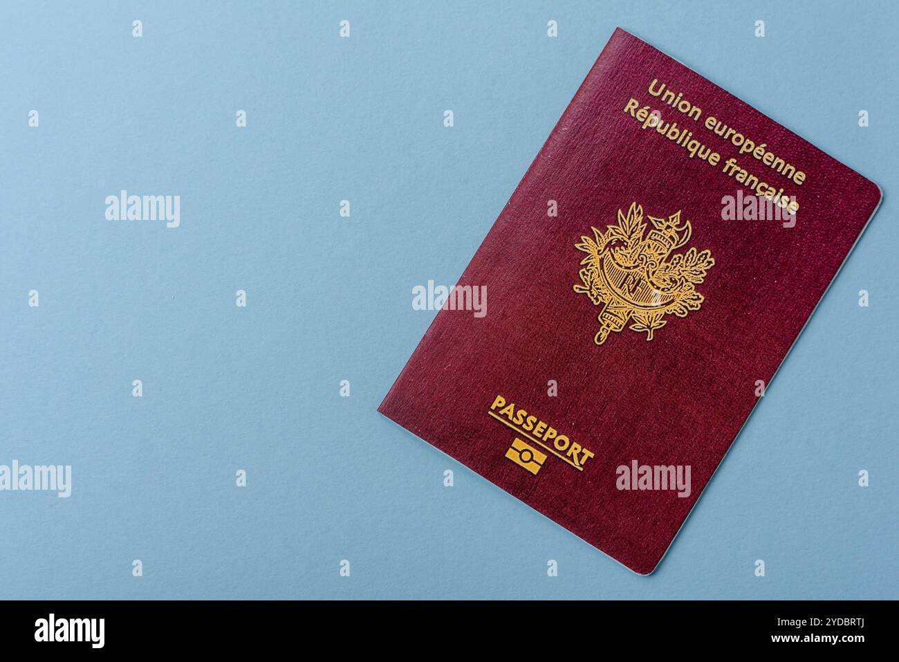 Passport of the Republic of France on a blue background Stock Photo - Alamy