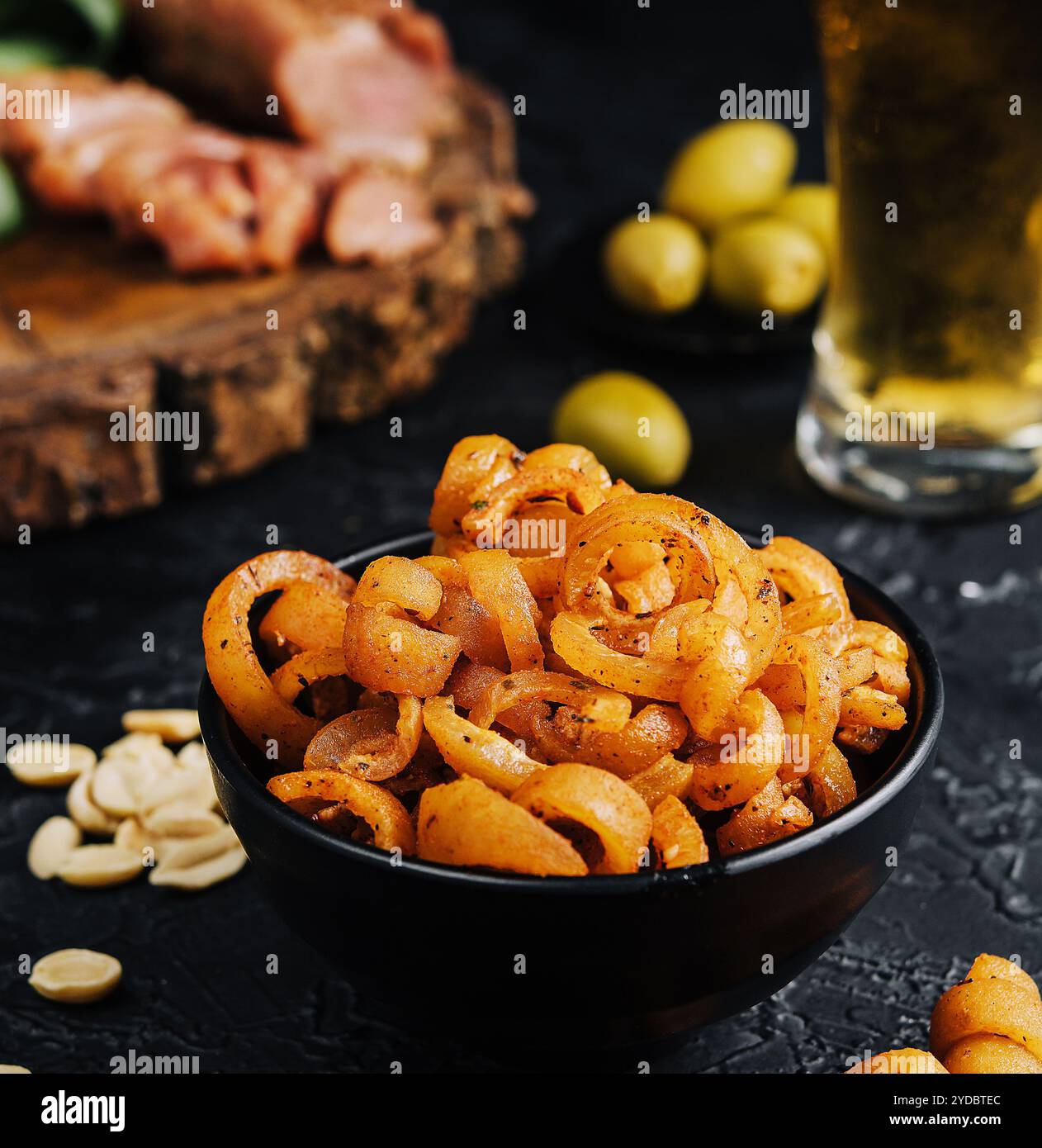 Pork ear snack in the bowl close up with beer in a glass Stock Photo ...