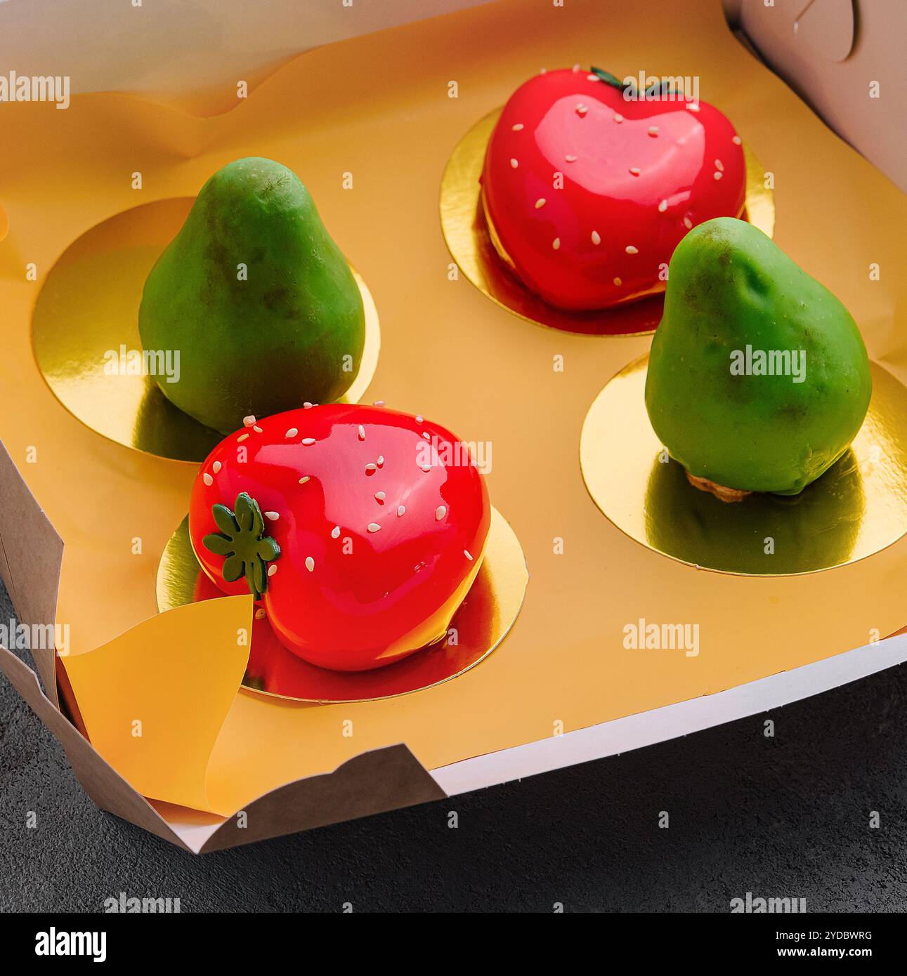 fruit-shaped mousse cakes in a box Stock Photo - Alamy