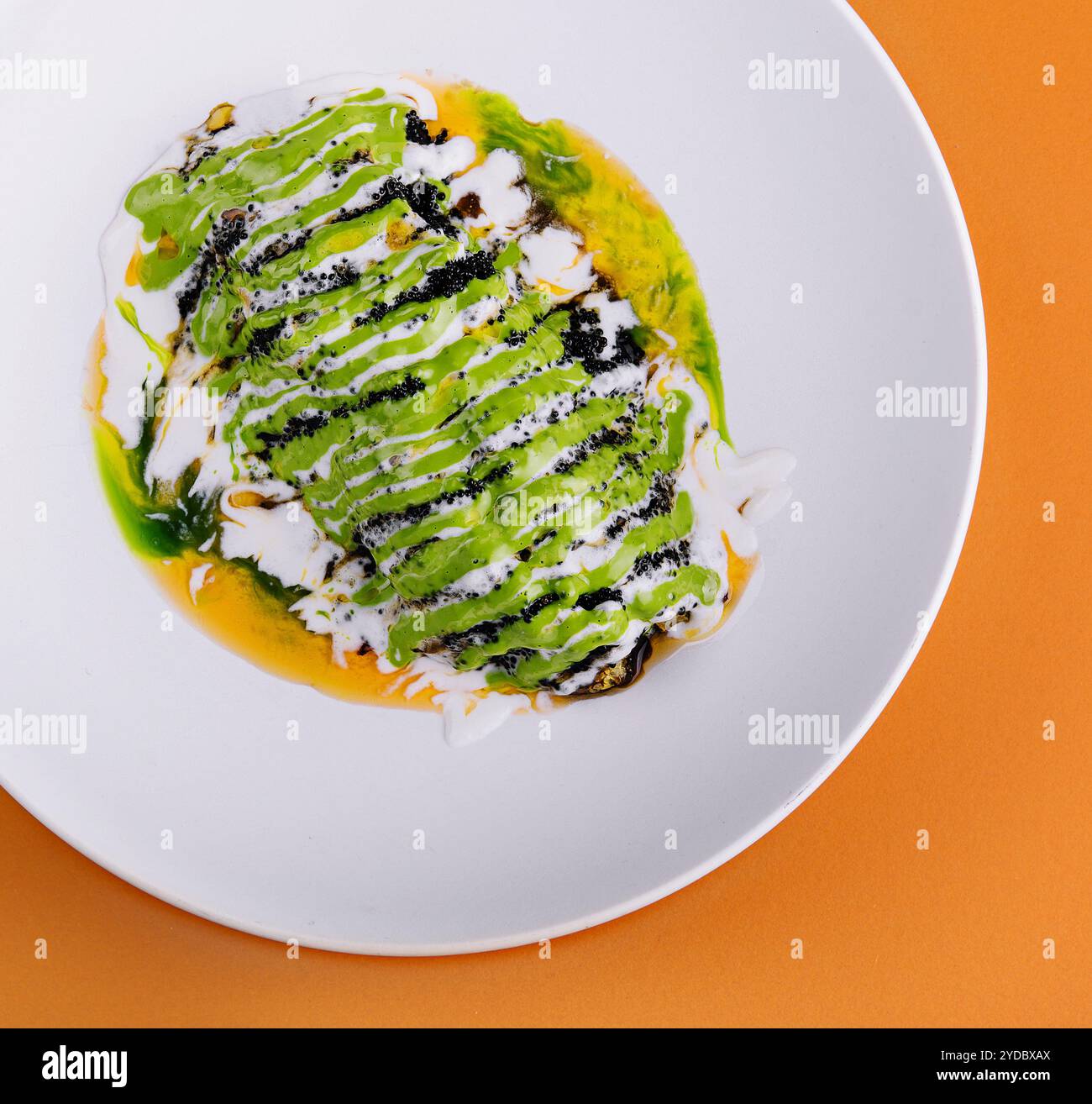 Fish with black caviar and sauce Stock Photo - Alamy