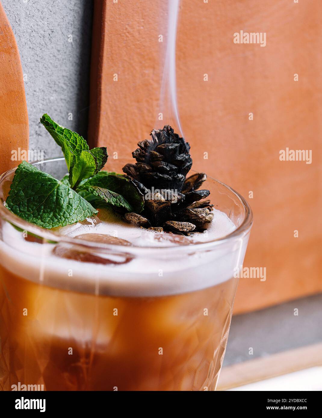 Cocktail with preserved sweet cedar cone Stock Photo - Alamy