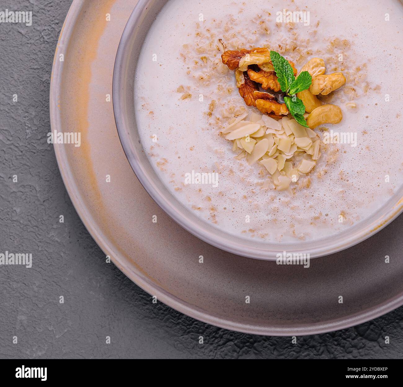 Homemade oatmeal flakes porridge with nuts Stock Photo - Alamy