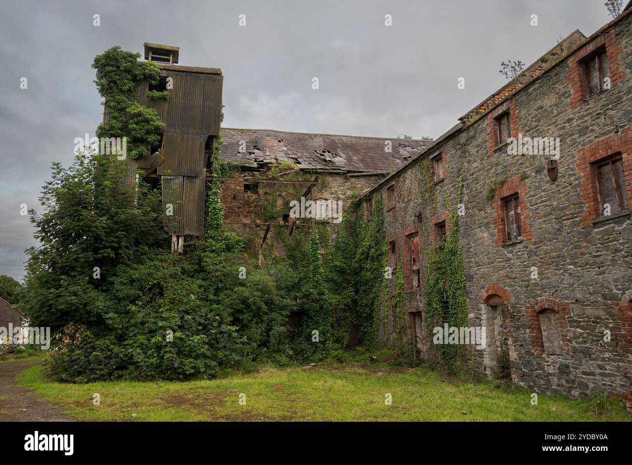 Ruins of an abandoned, industrial building shows crumbling stone and ...