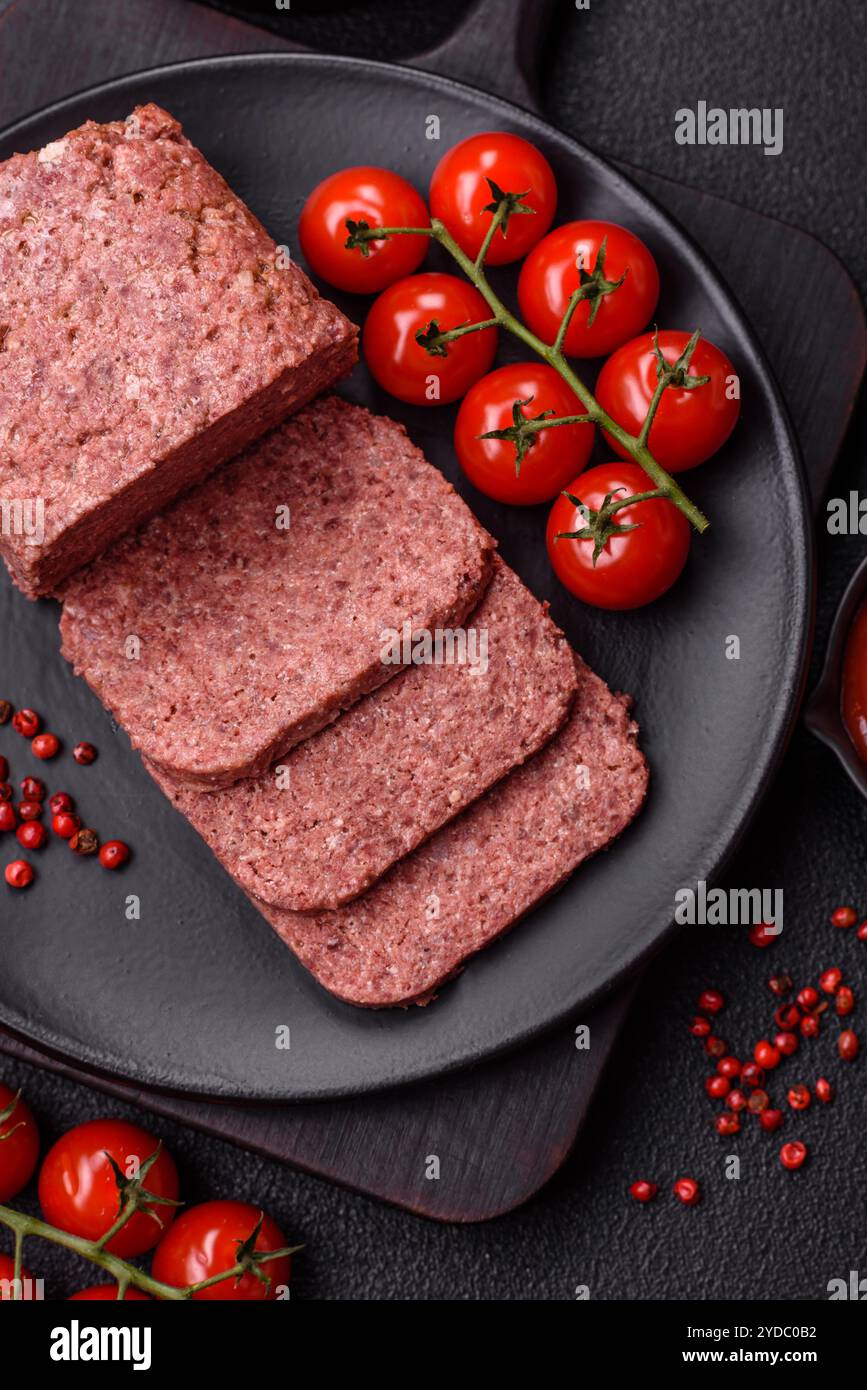 Delicious canned pink ham with salt, spices and herbs Stock Photo - Alamy