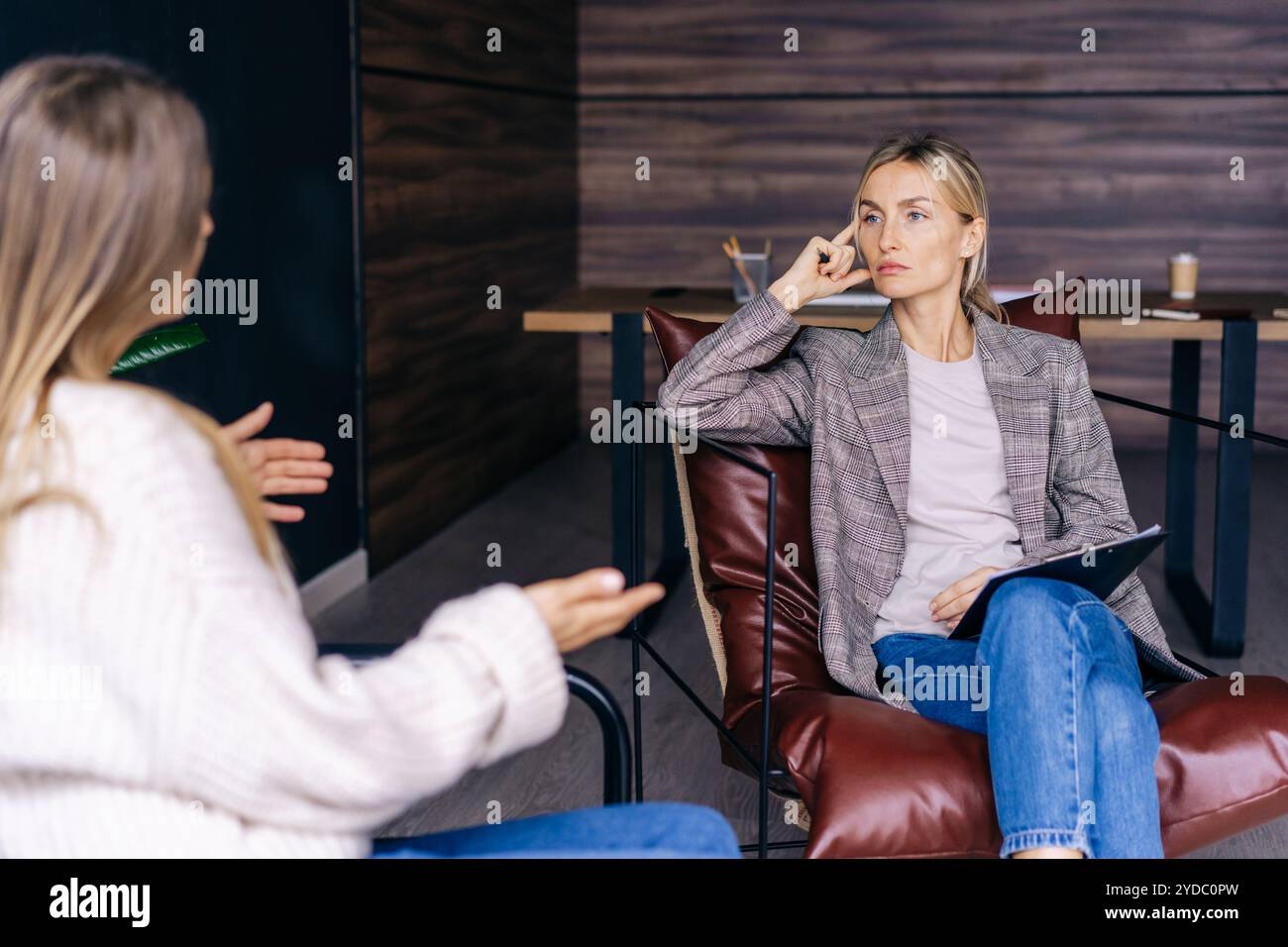 Smart attractive woman professional attentively listens to the client ...