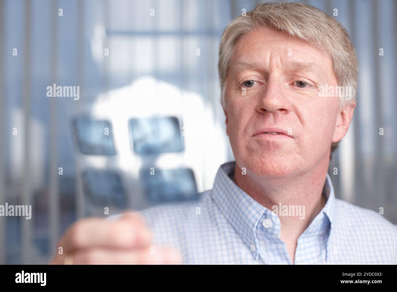 Mature, man and dentist with x ray scan for teeth growth, dental ...