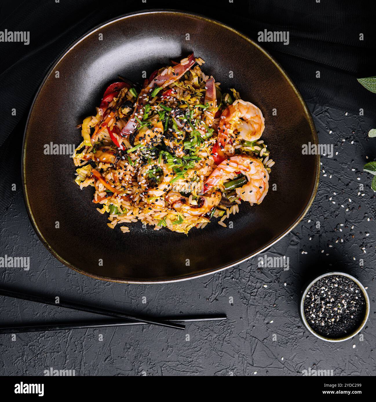 Top view of fried rice with seafood and vegetables prepared in Chinese ...