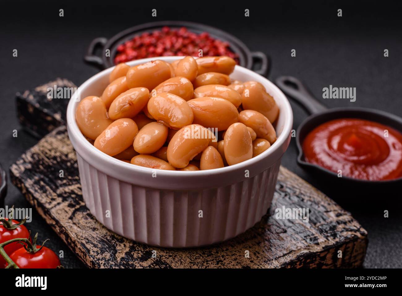Delicious nutritious canned beans in tomato, with salt and spices as a ...