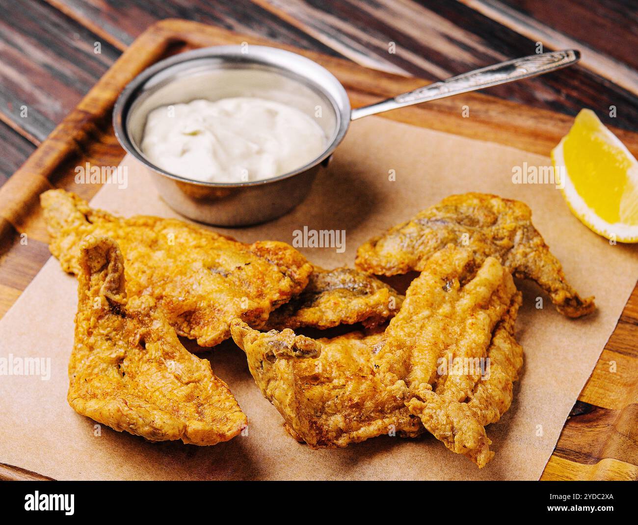 Crispy fried fish on a wooden rustic board Stock Photo - Alamy