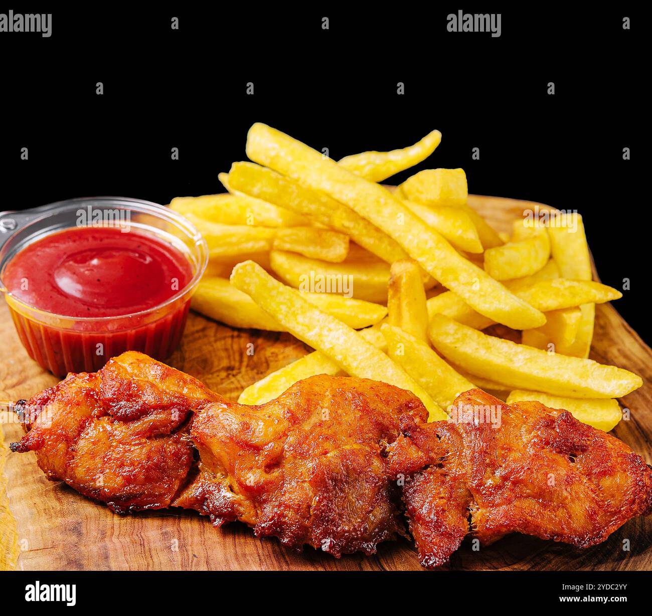 Fried pork barbecue with French fries Stock Photo - Alamy