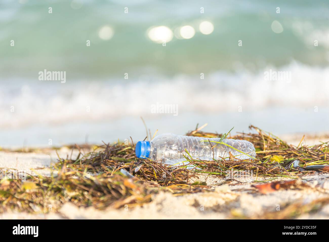 Plastic bottle cap washed up on beach hi-res stock photography and ...