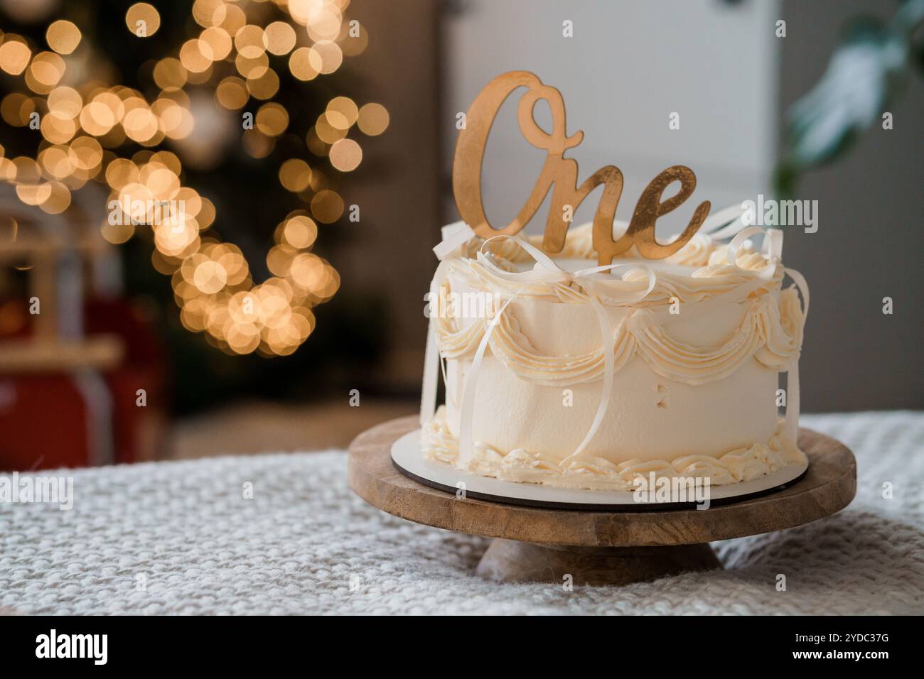 First Birthday Celebration Cake with Elegant Gold Topper and Soft ...