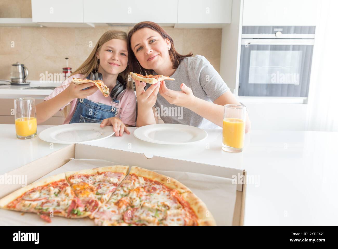 Girl eating a pizza hi-res stock photography and images - Alamy