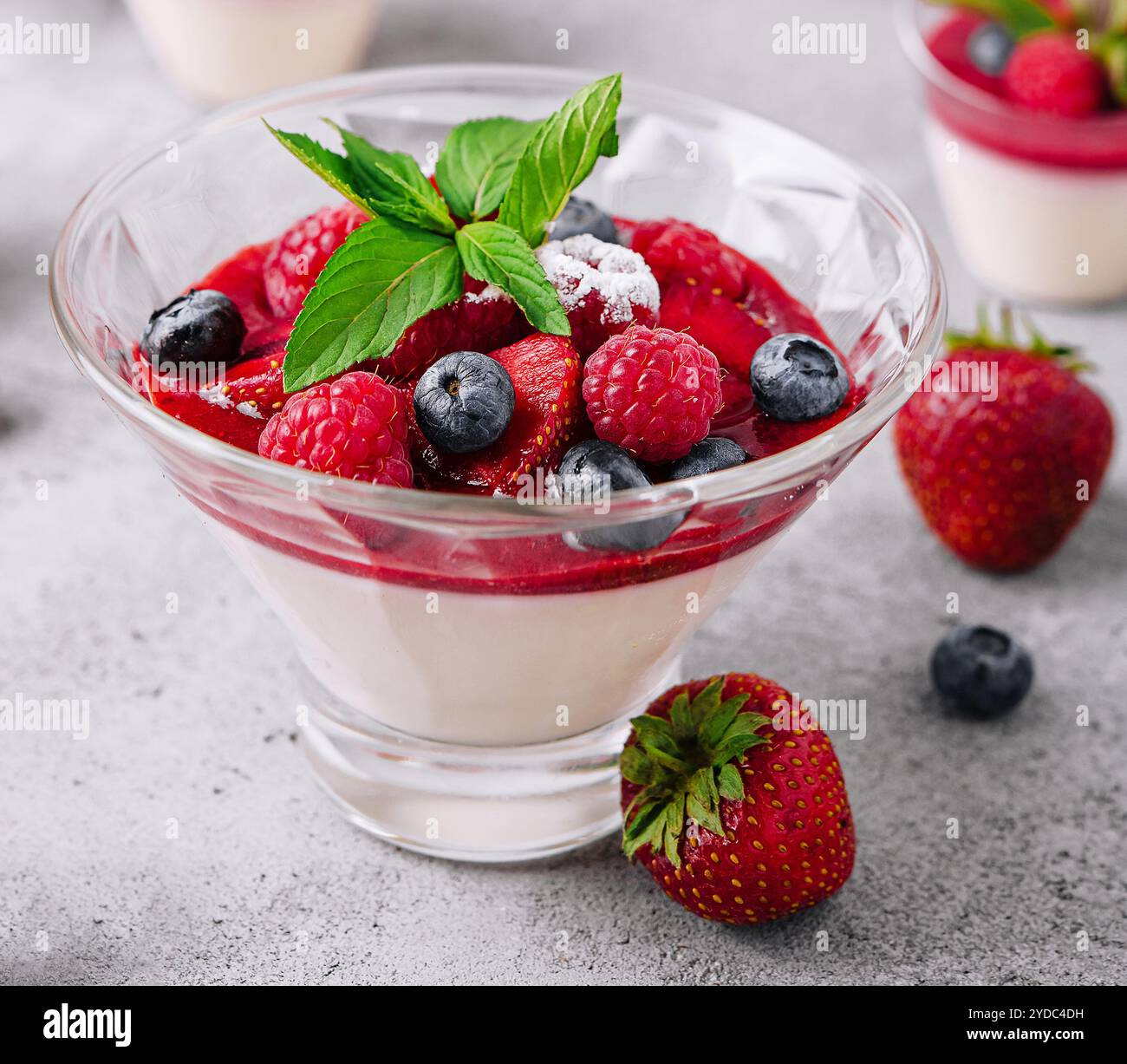 Italian dairy dessert panna cotta with raspberry jam Stock Photo - Alamy