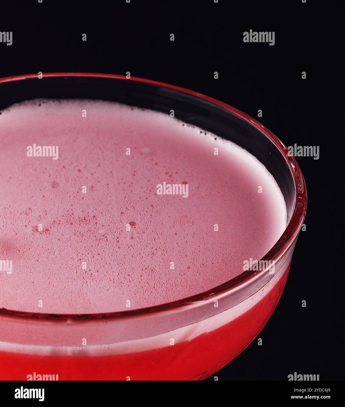 Red, sweet berry cocktail with froth Stock Photo - Alamy