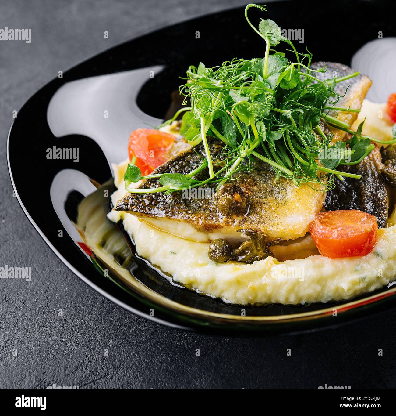 Fried norwegian skrei cod fish filet with mashed potatoes Stock Photo ...