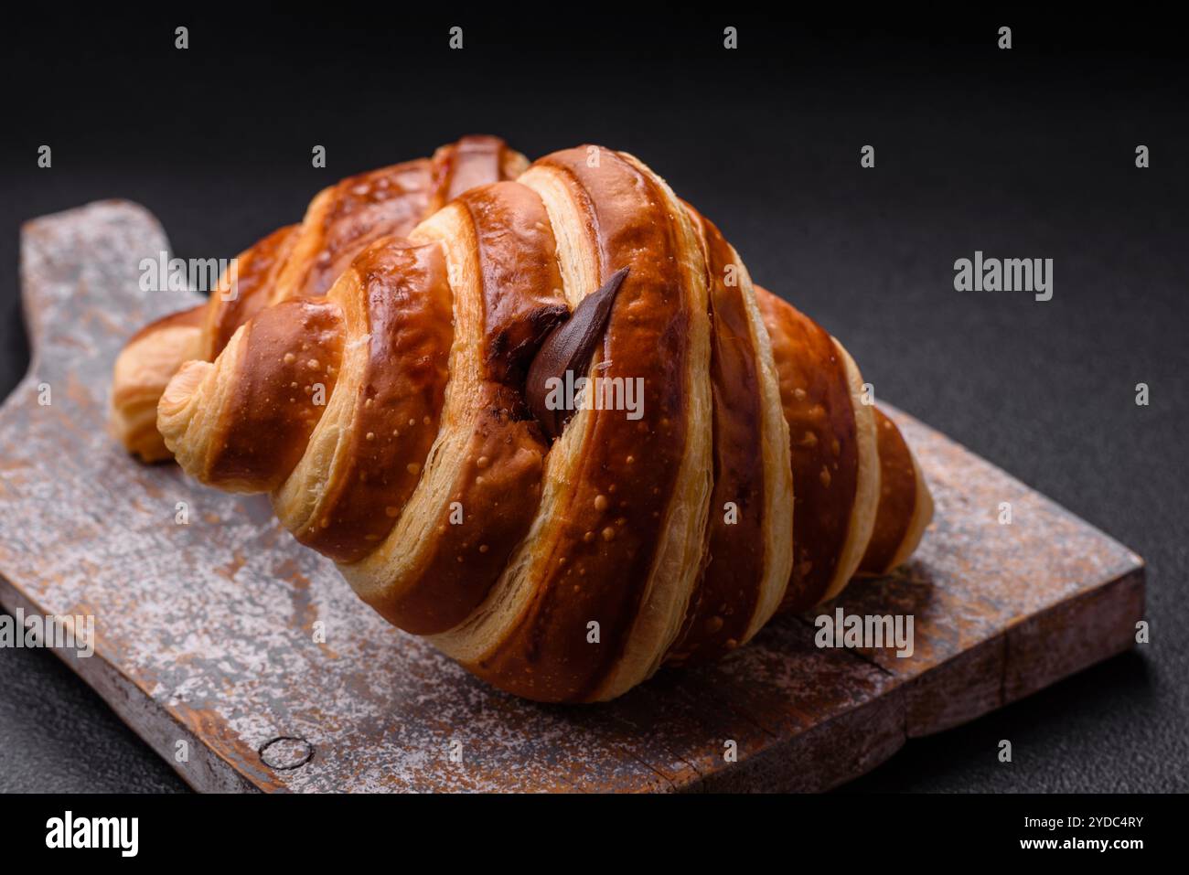 Delicious crispy sweet croissant cornet with chocolate Stock Photo - Alamy