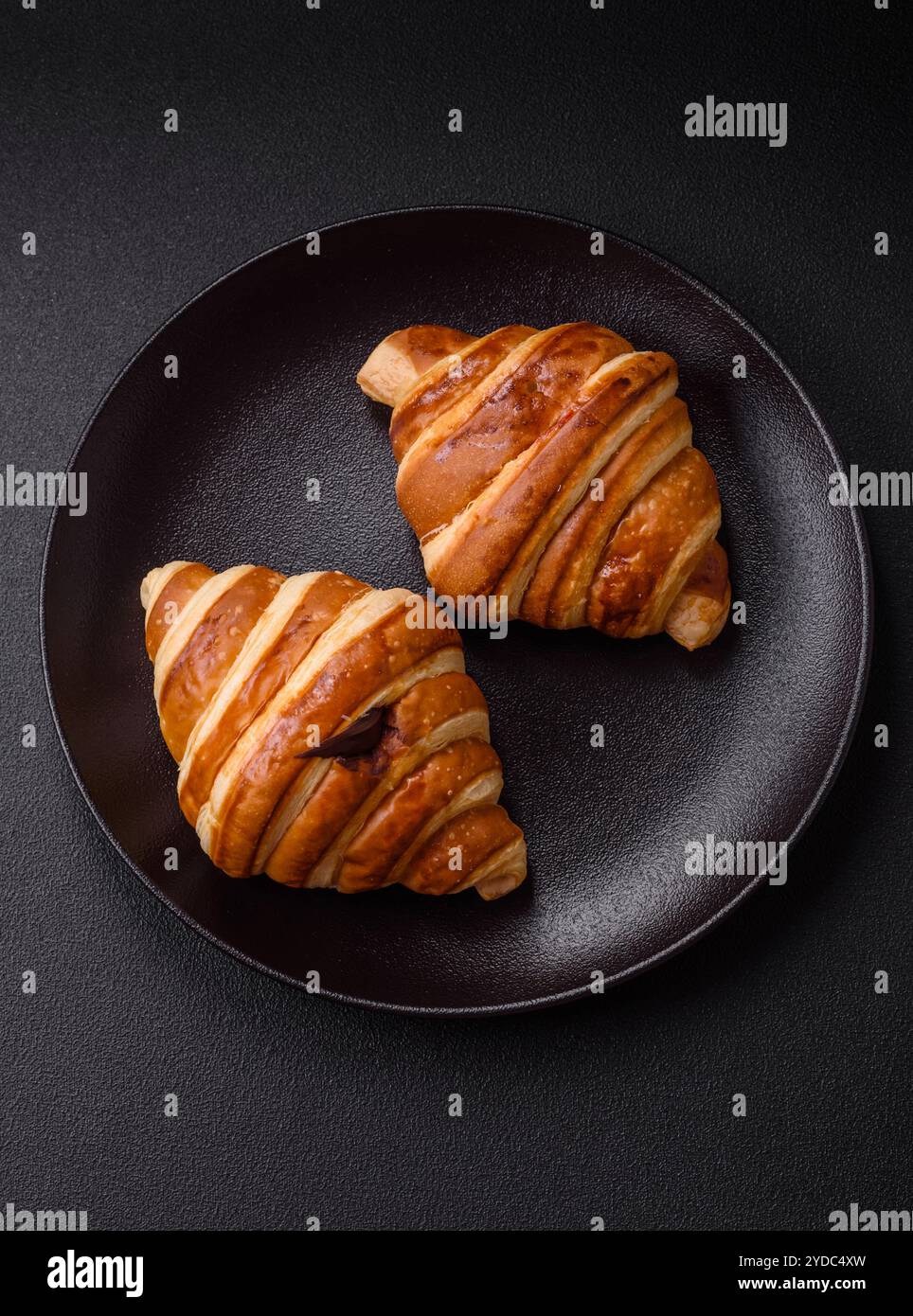 Delicious crispy sweet croissant cornet with chocolate Stock Photo - Alamy